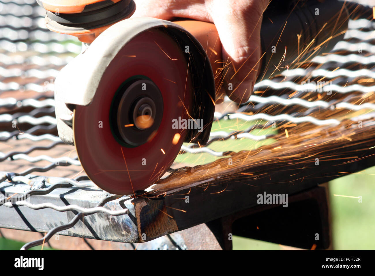 Grinder grinding a metal part Stock Photo - Alamy