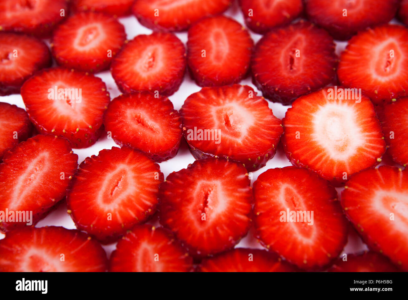 background a strawberry slices close-up and macro Stock Photo - Alamy