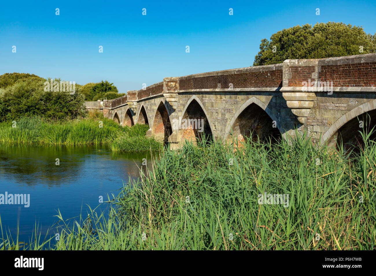 Wimborne Minster Dorset England June 30, 2018 Old stone bridge crossing ...
