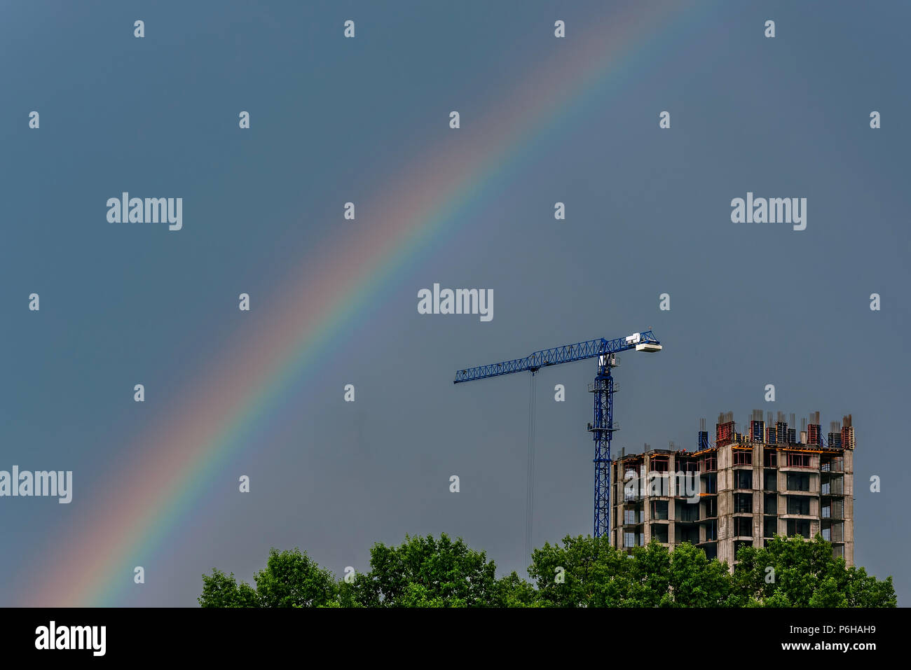 Crane with high rise building hi-res stock photography and images - Alamy