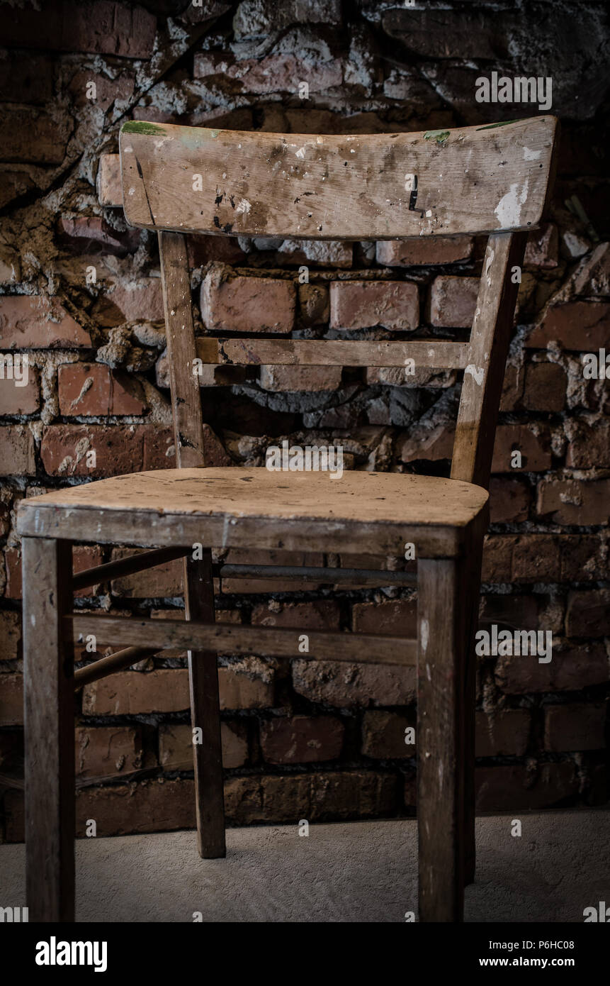 Chair in front of a brick Stock Photo - Alamy