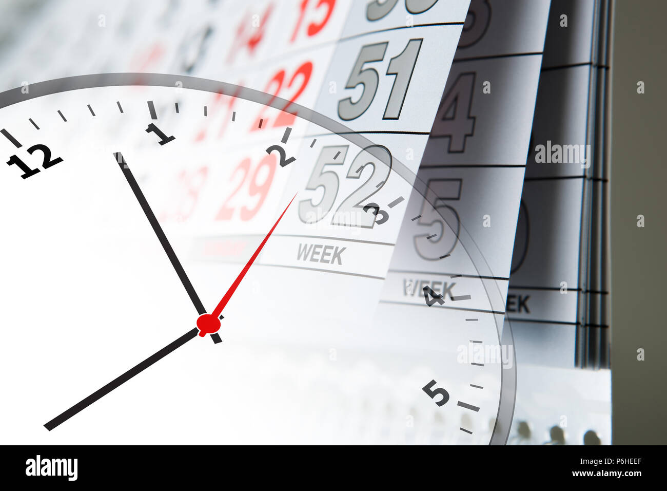 large wall calendar and clock close-up Stock Photo - Alamy