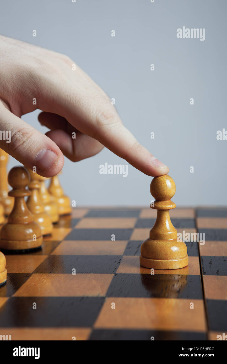 hand of man making a move chess figure Stock Photo - Alamy