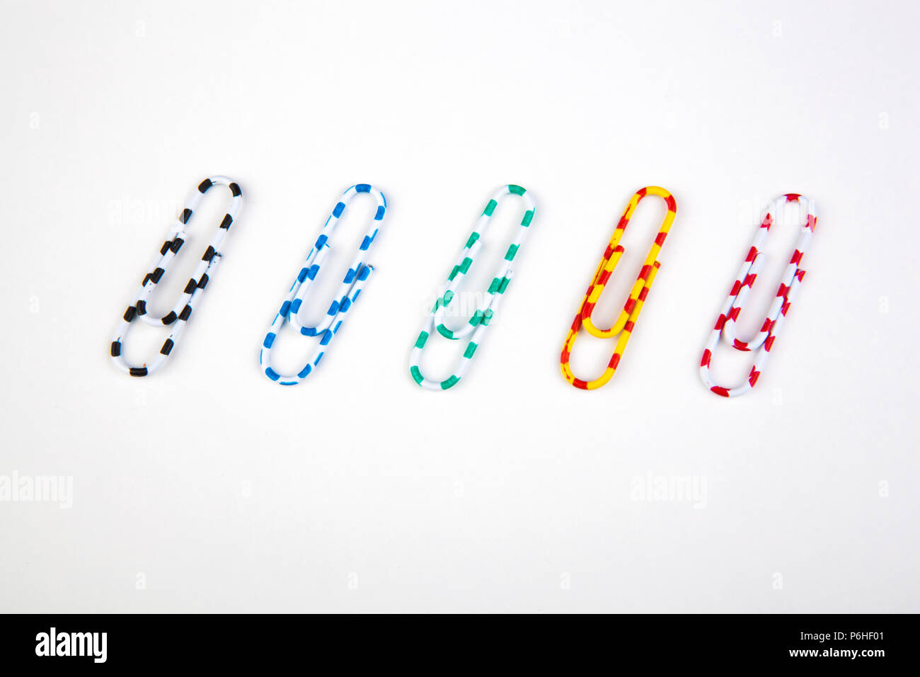 Five colored zebra paper clips Stock Photo - Alamy
