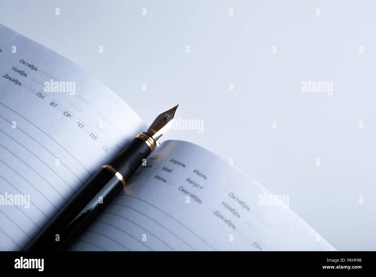 diary with fountain pen on white close-up Stock Photo - Alamy