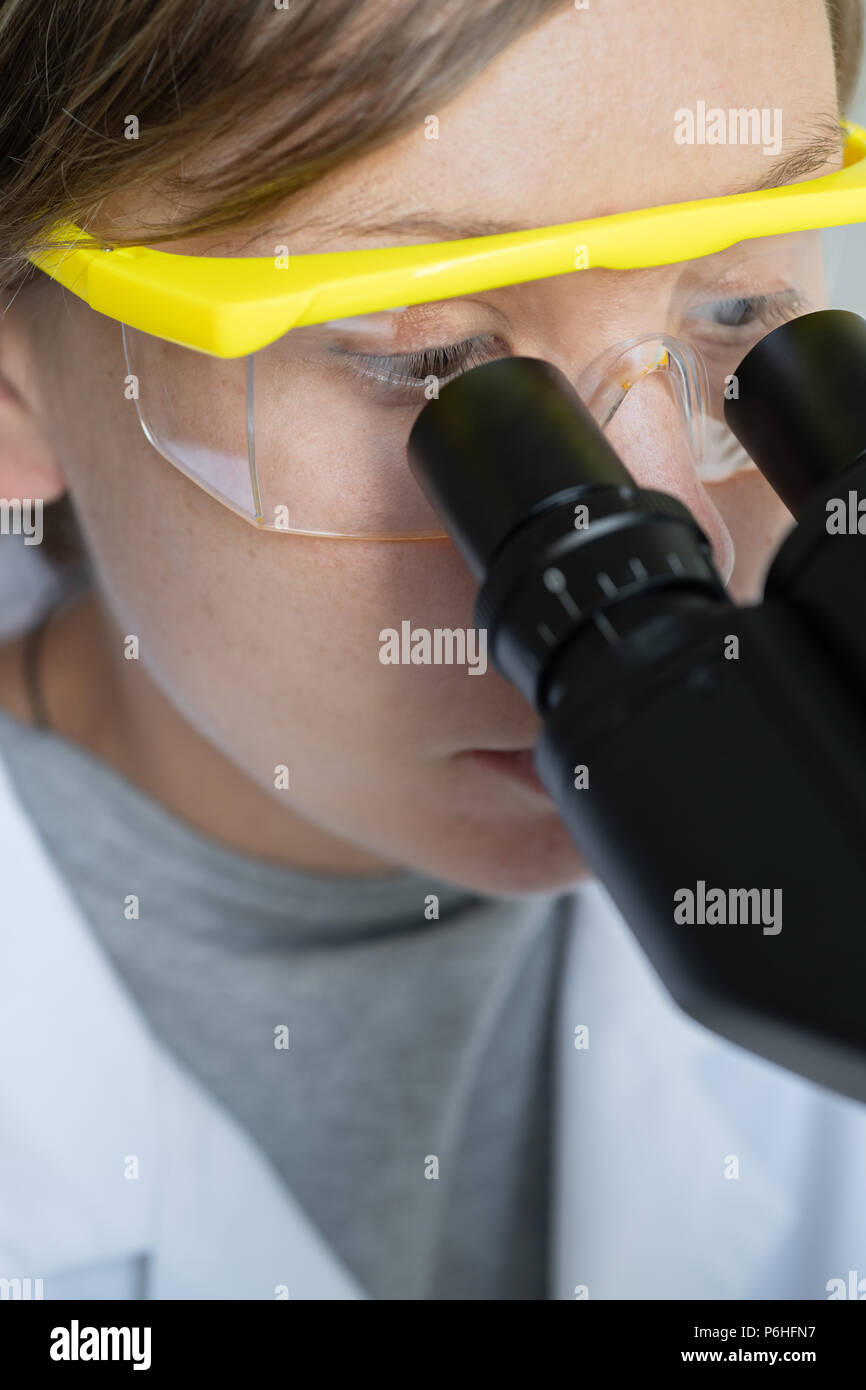 Microscope looking into hi-res stock photography and images - Alamy
