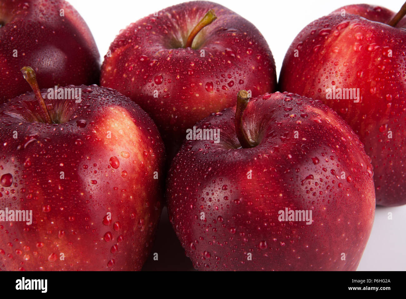 maroon apples closeup on a white background Stock Photo - Alamy