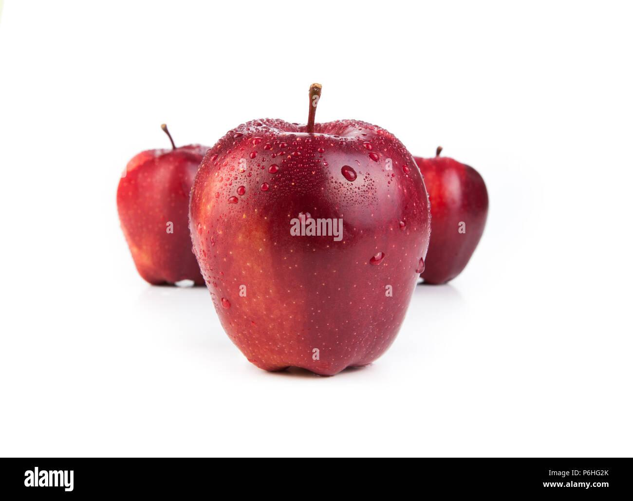maroon apples closeup on a white background Stock Photo - Alamy
