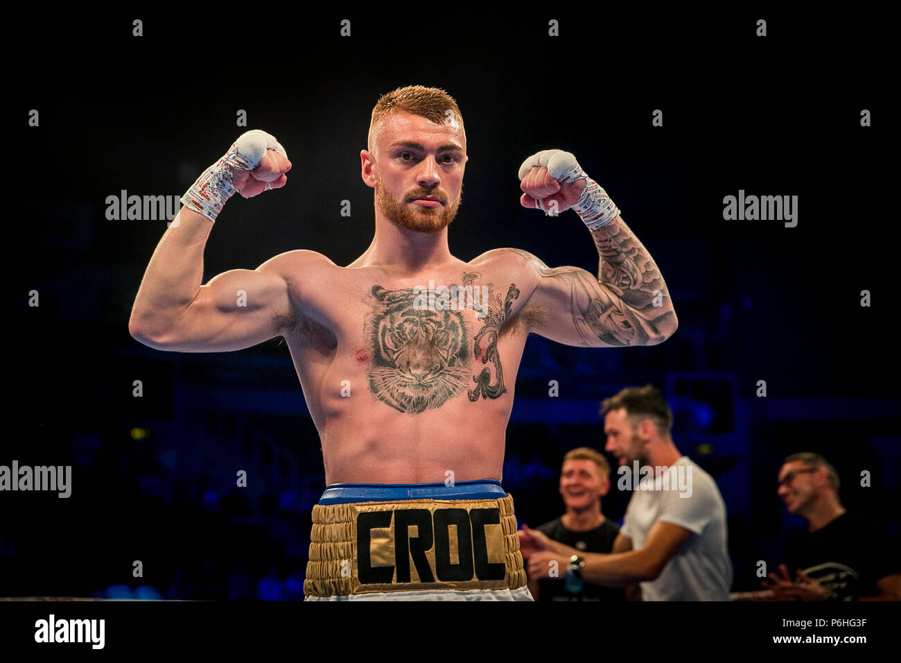 Lewis Crocker (white shorts gold trim) uses after defeating Adam Grabie ...