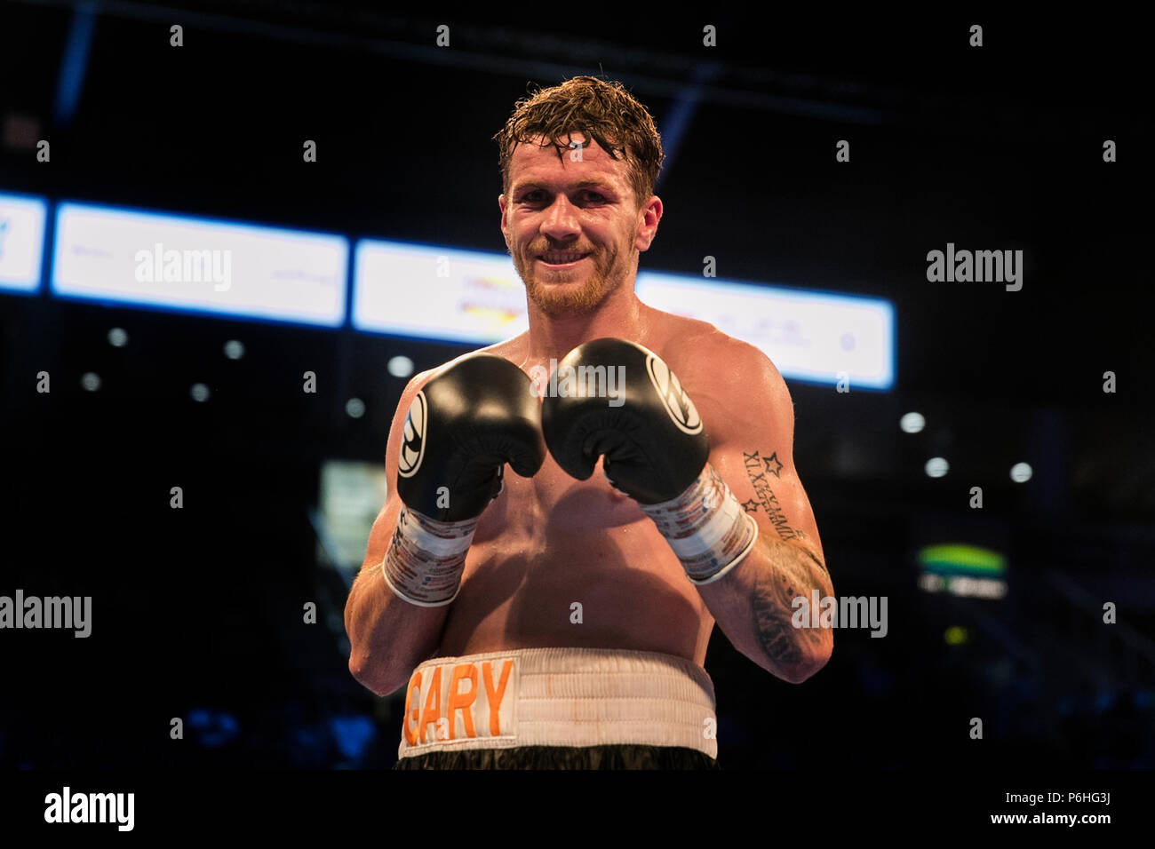 Gary Corcoran (black shorts) poses after defeating Victor Ray Ankrah ...