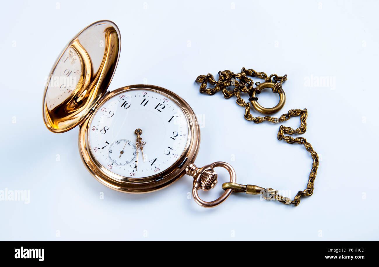 Gold pocket watch on white background close-up Stock Photo - Alamy