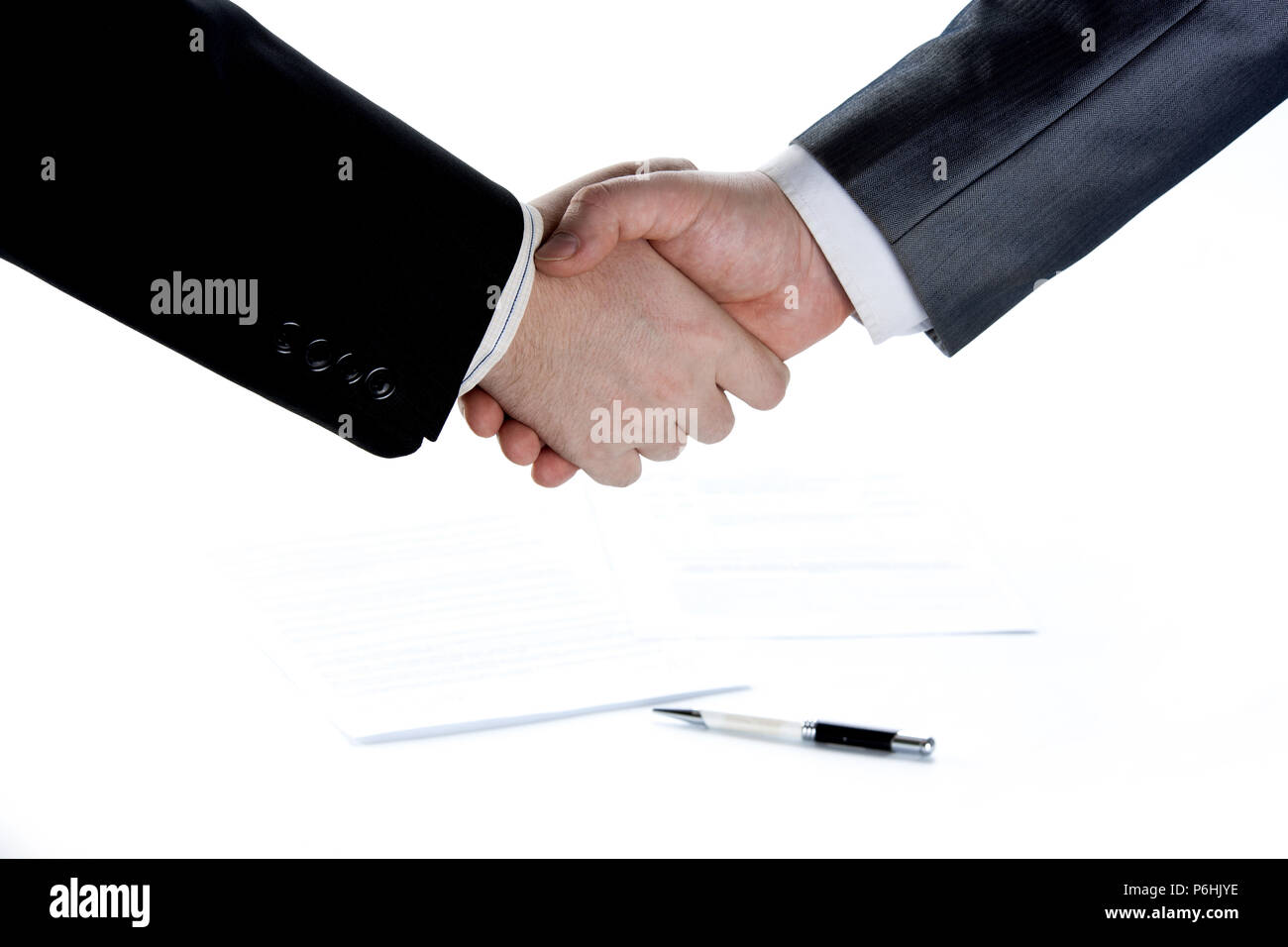 signing of the agreement and a handshake on white background Stock ...