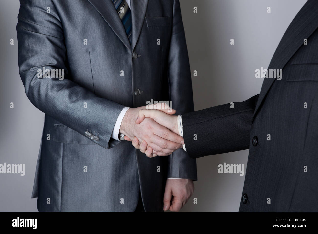 signing of the agreement and a handshake on white background Stock ...