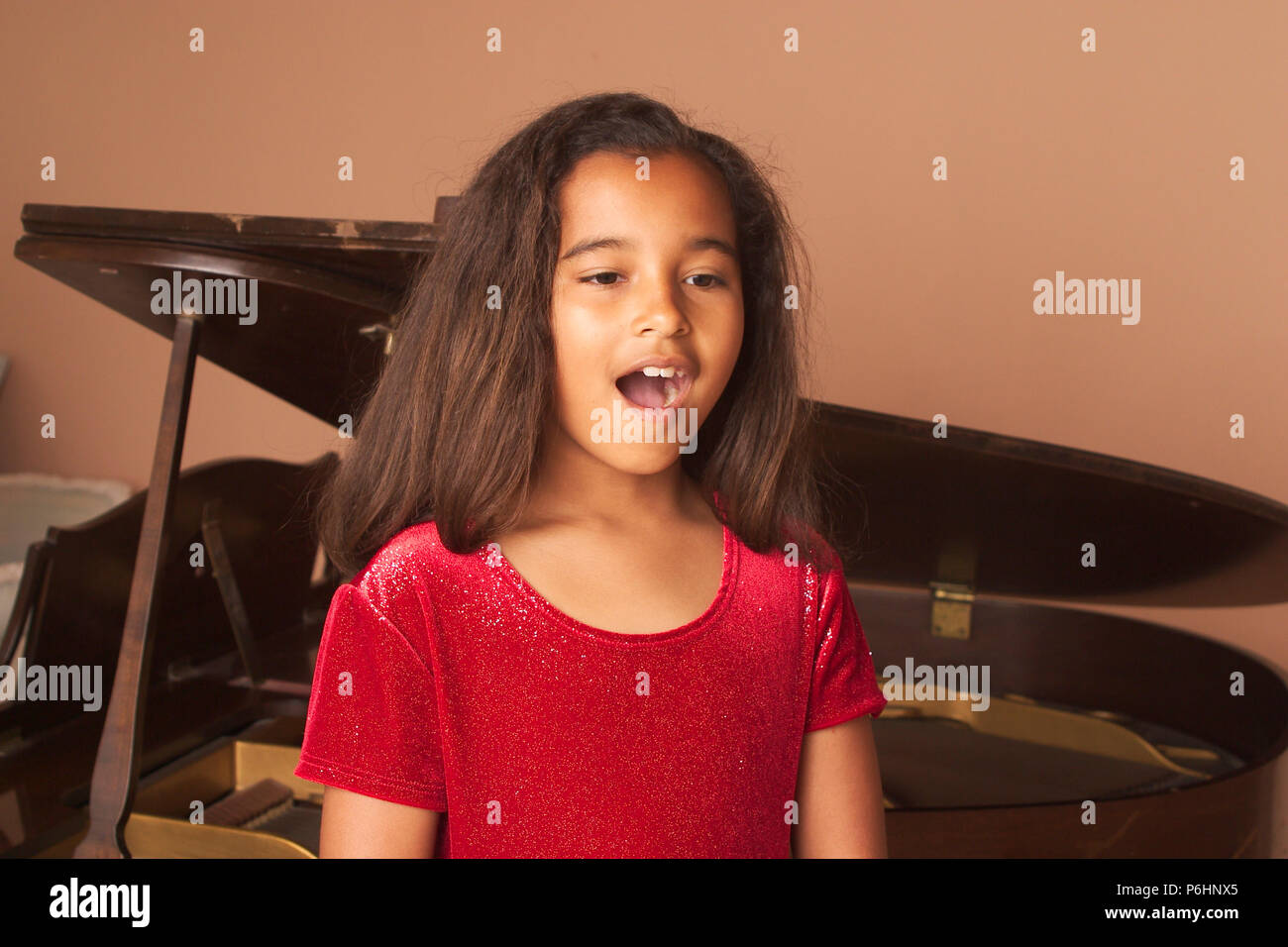 Young girl happily singing, MR © Myrleen Pearson. .......Ferguson Cate ...