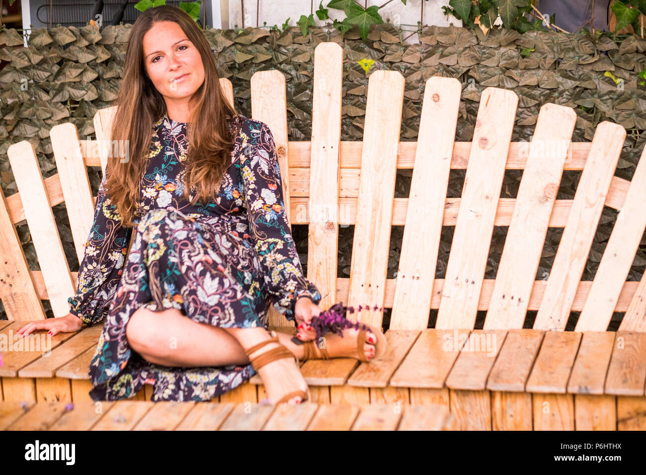hippy style dress and hair lady like '70s sitting on a wood bench made ...