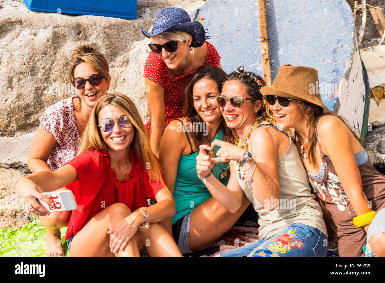 group of beautiful young females friends having fun together outdoor in ...