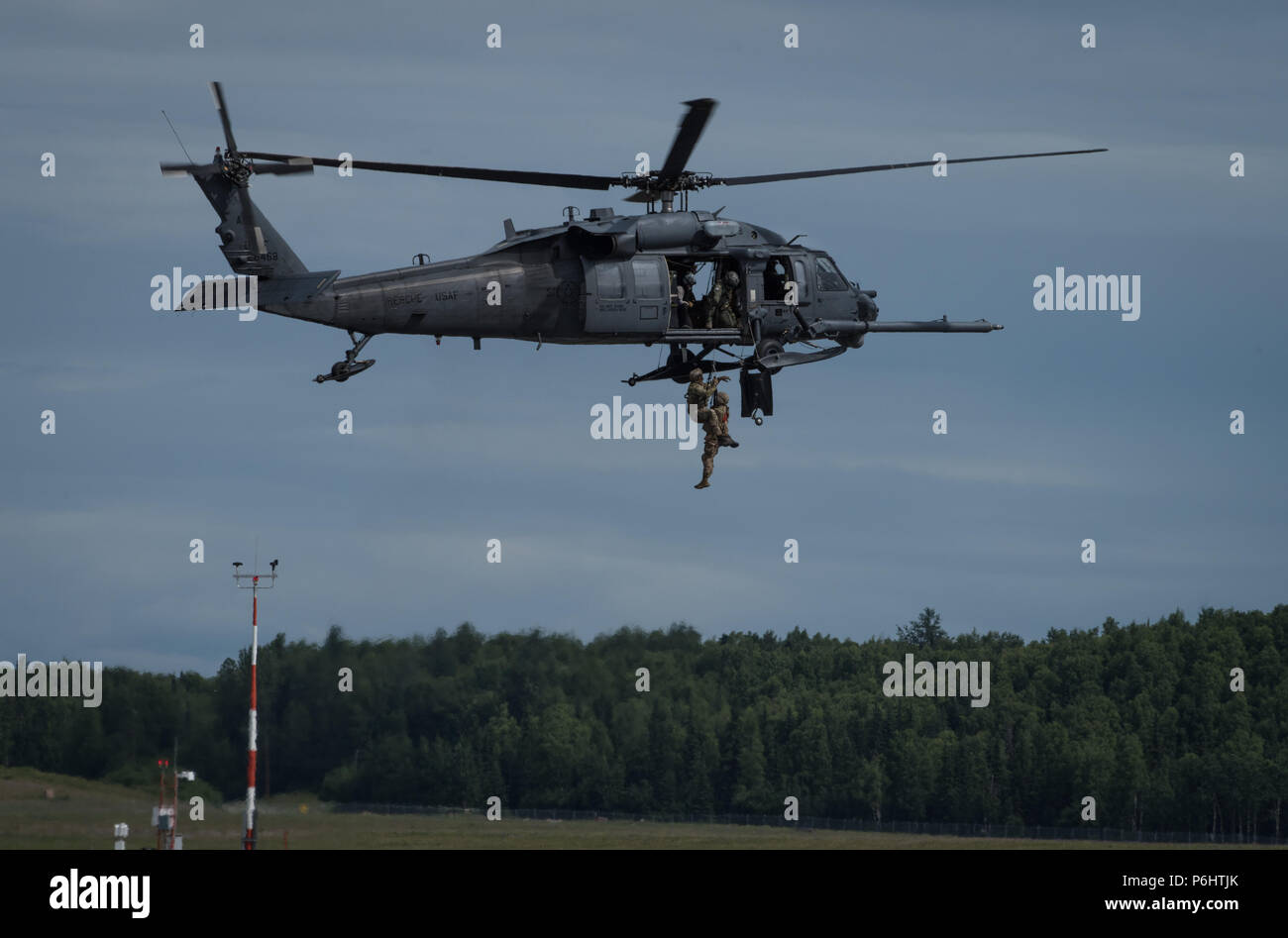 U.S. Air Force pararescuemen from the Alaska Air National Guard 212th ...