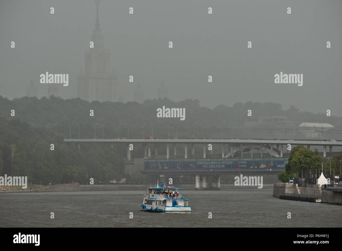 Russian weather, Moscow. Saturday, June 30, 2018. Leisure boat goes up ...