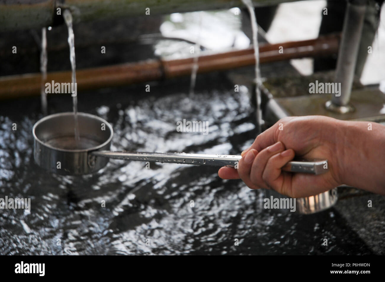 Washing hands in the Izumo Taisha Shrine in Shimane, Japan. To pray ...