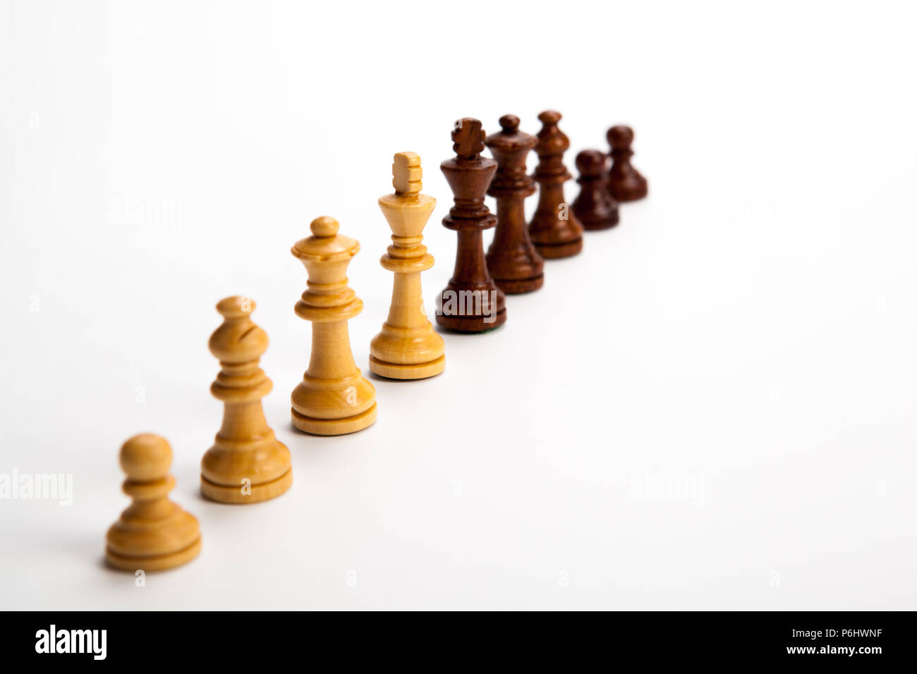 Number of chess pieces on white background Stock Photo - Alamy