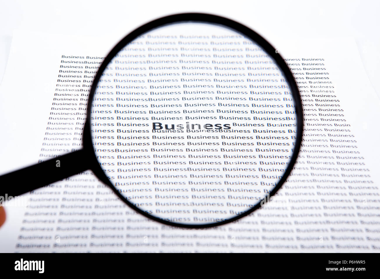 Magnifier, pencil and paper close-up Stock Photo - Alamy