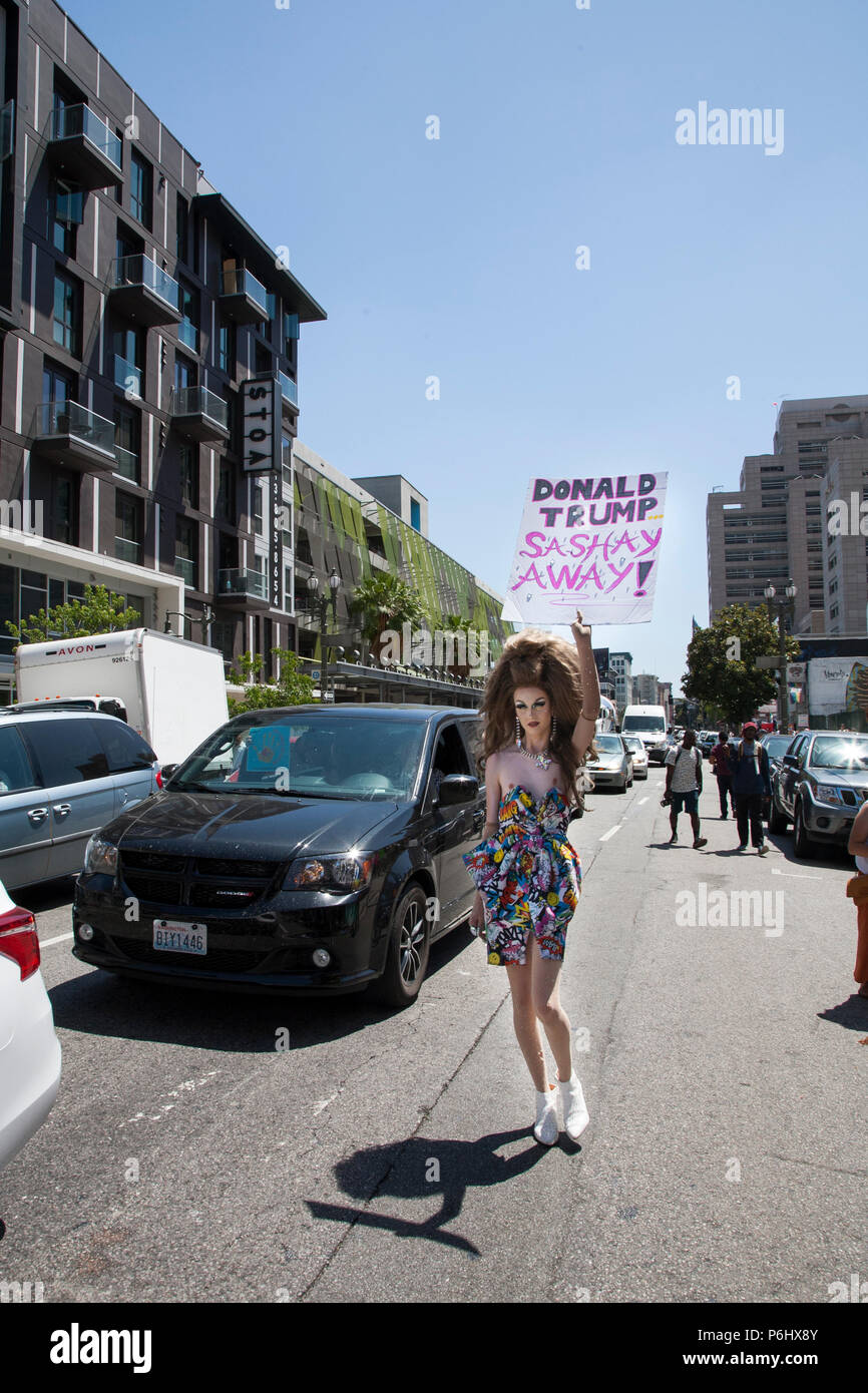 A drag queen walks through traffic in downtown Los Angeles, during the ...