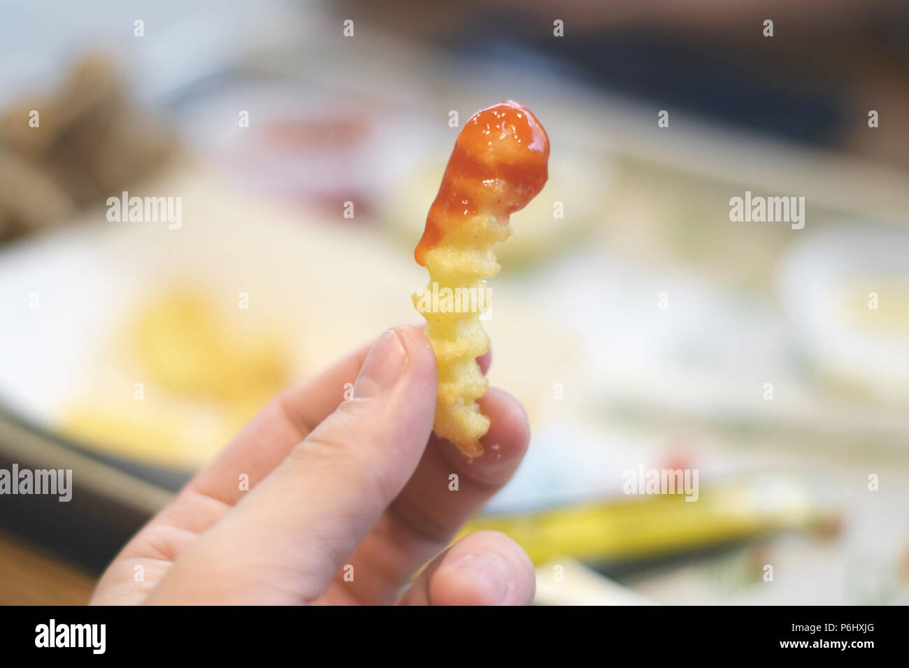 Hand holding french fries mayonnaise hi-res stock photography and ...