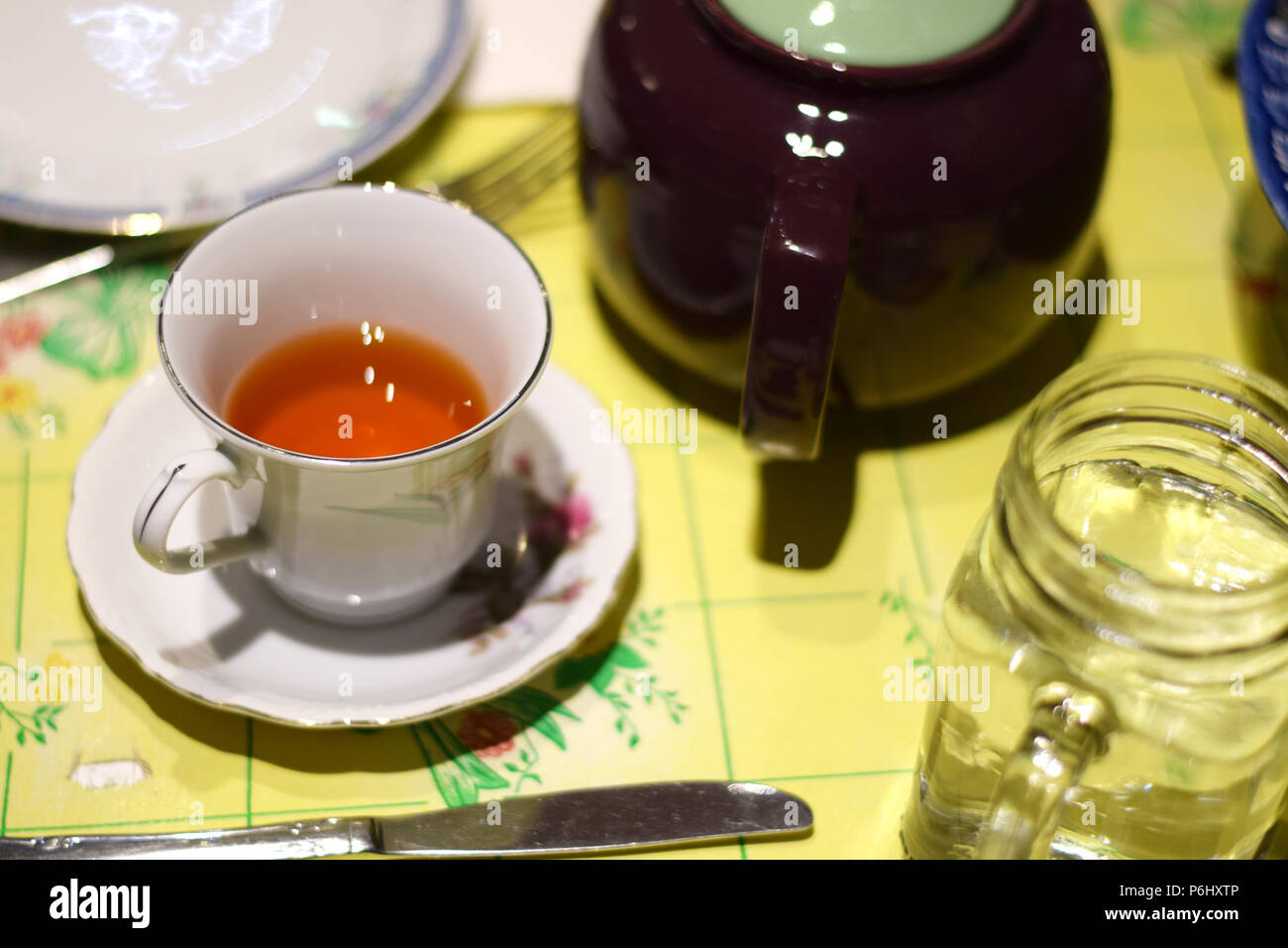 Tea cup on table with tea in it Stock Photo - Alamy