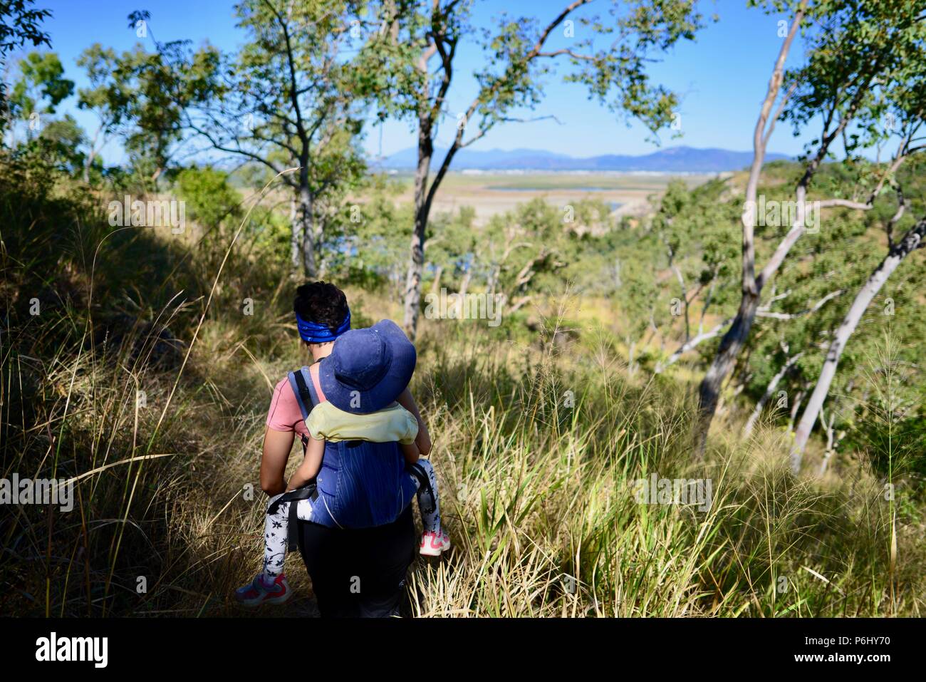 Mother walks with children through the Australian bush, Many peaks hike ...