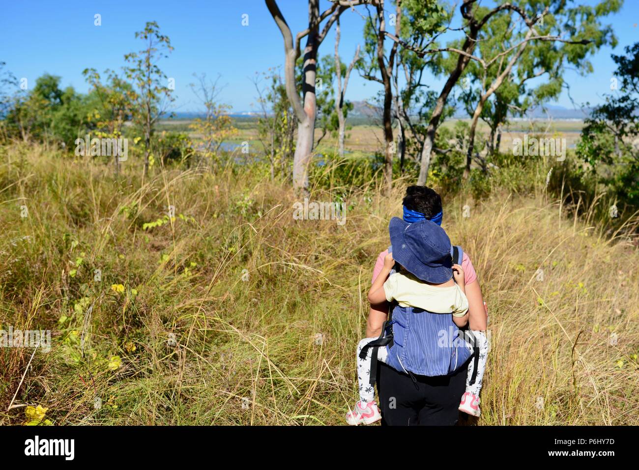 Mother walks with children through the Australian bush, Many peaks hike ...