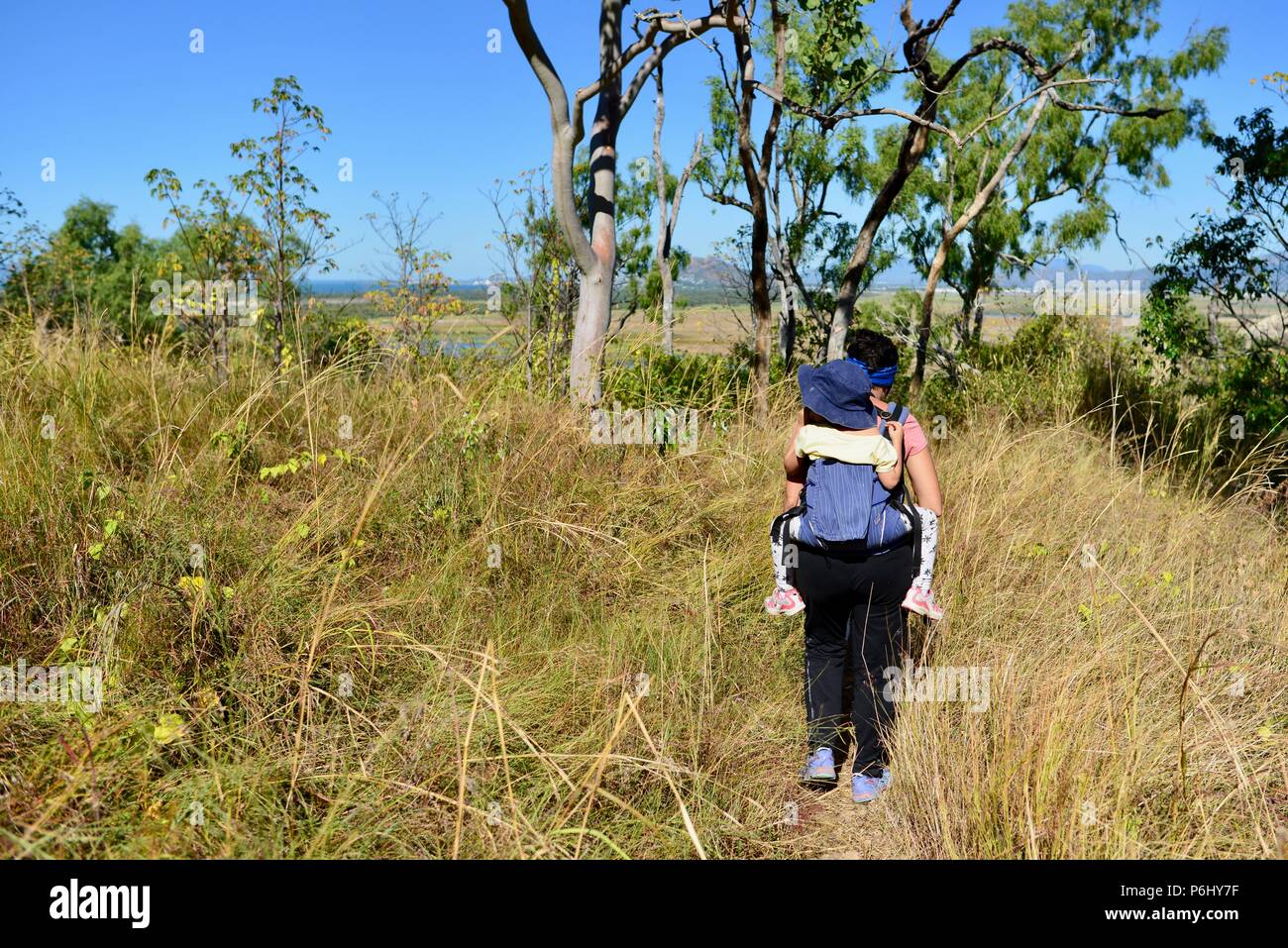 Mother walks with children through the Australian bush, Many peaks hike ...