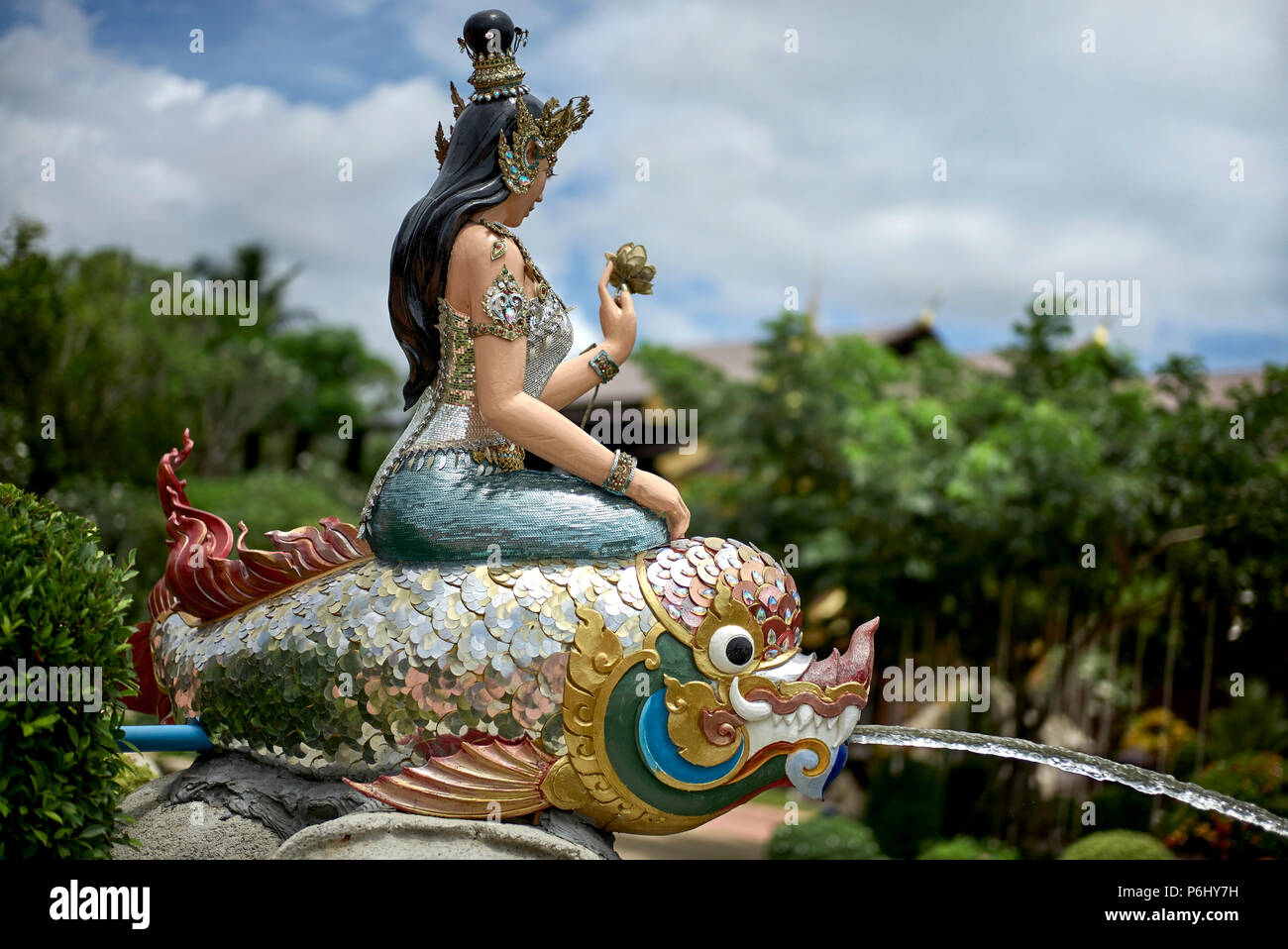 Thailand statue of a mermaid sitting astride a fish Stock Photo - Alamy