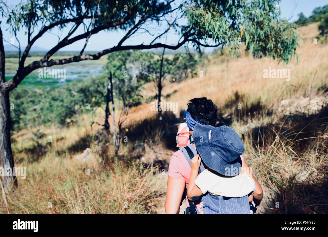 Mother walks with children through the Australian bush, Many peaks hike ...