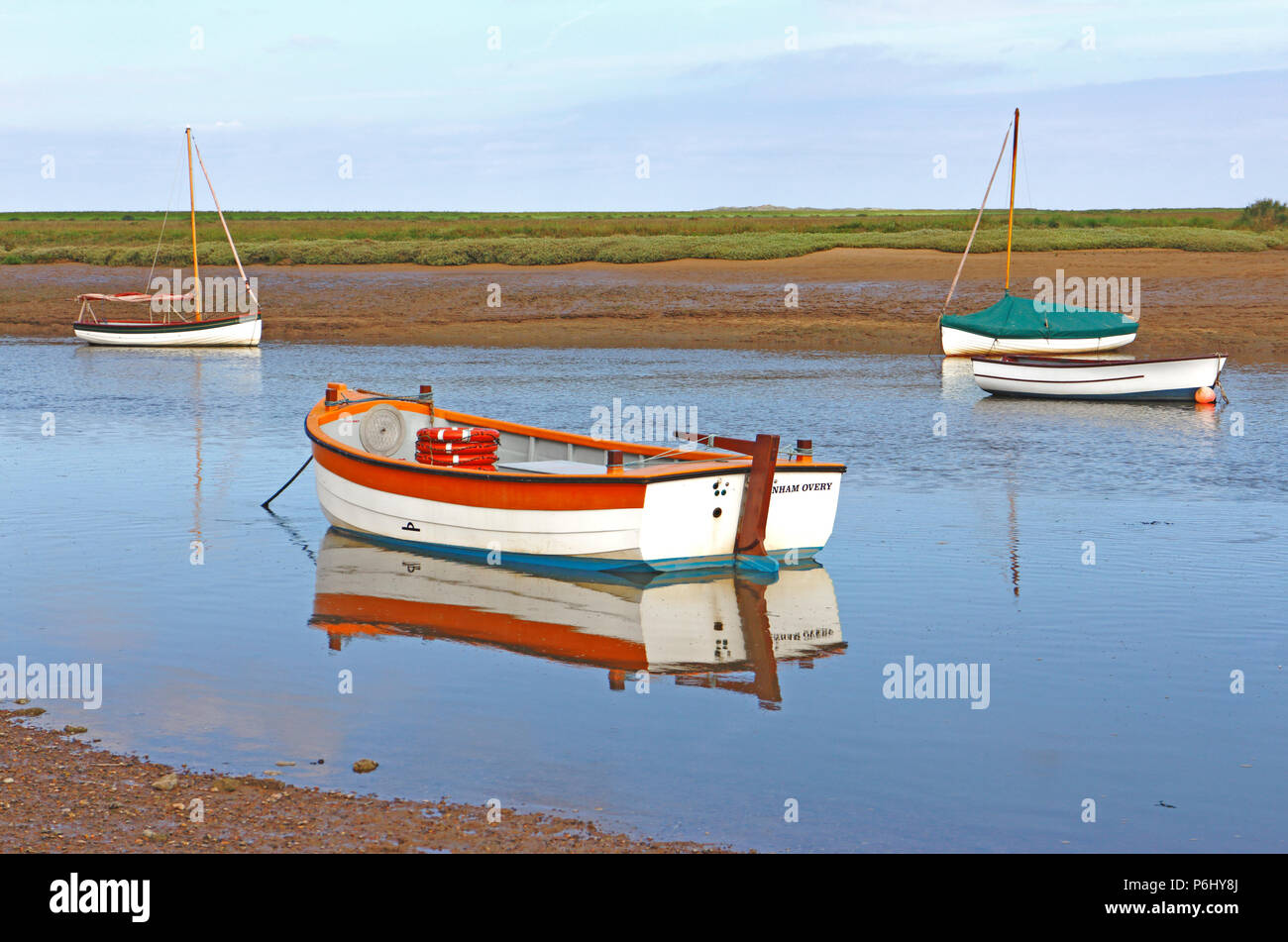 A triangular composition featuring small boats in Overy Creek on the ...
