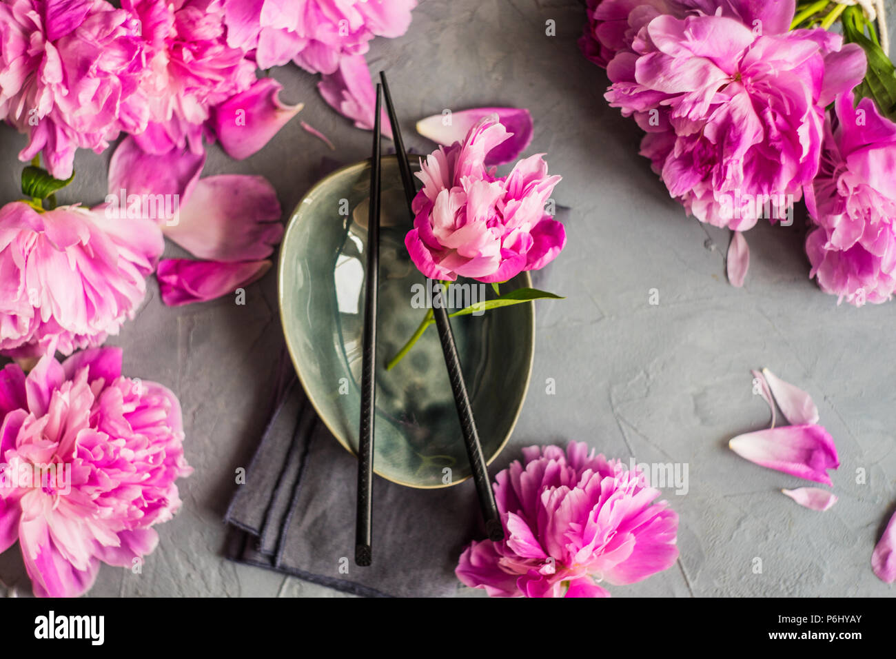 Summer table setting with pink peony flowers on rustic background with copy space Stock Photo ...