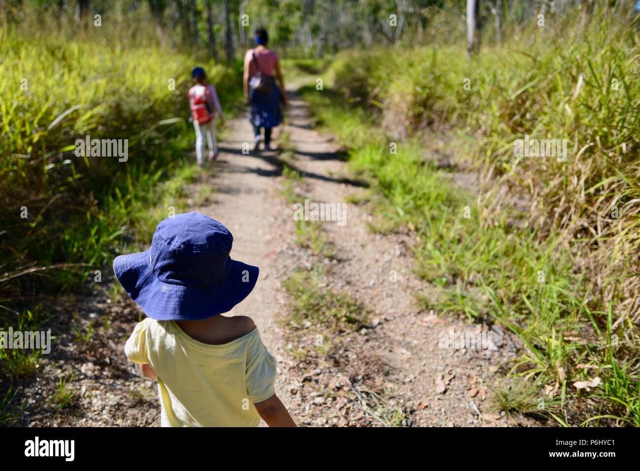 Mother walks with children through the Australian bush, Many peaks hike ...