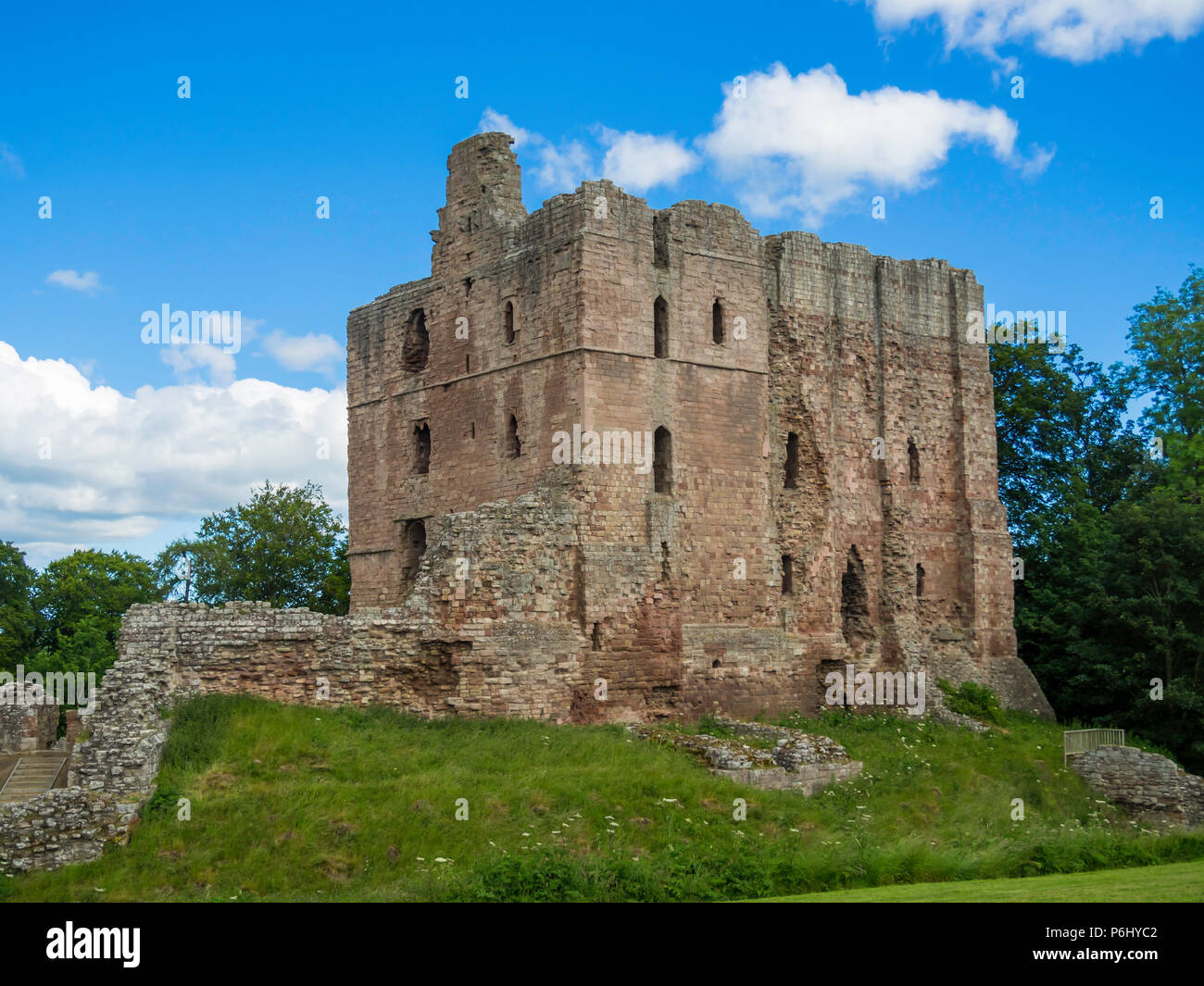 Ruins of Norham Castle on the south bank of the river Tweed which from ...