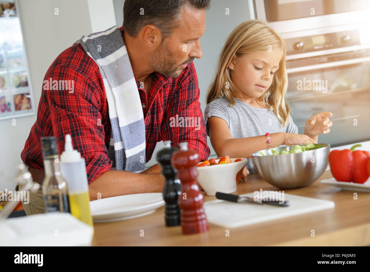 Father and daughter cooking pasta dish together Stock Photo - Alamy