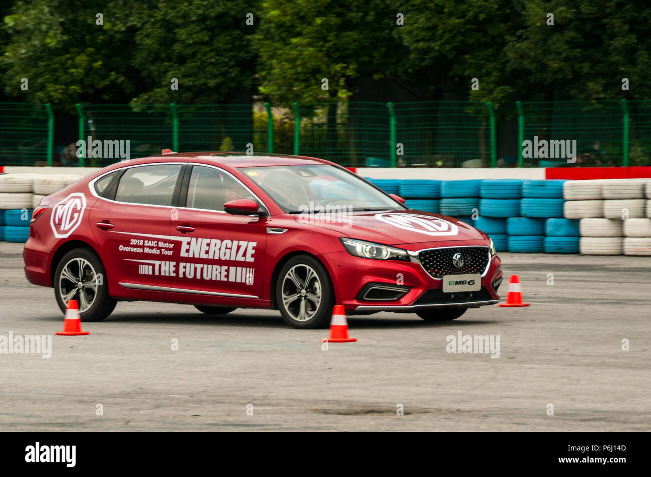 An eMG 6 from Chinese car manufacturer SAIC manoeuvring on a slalom ...