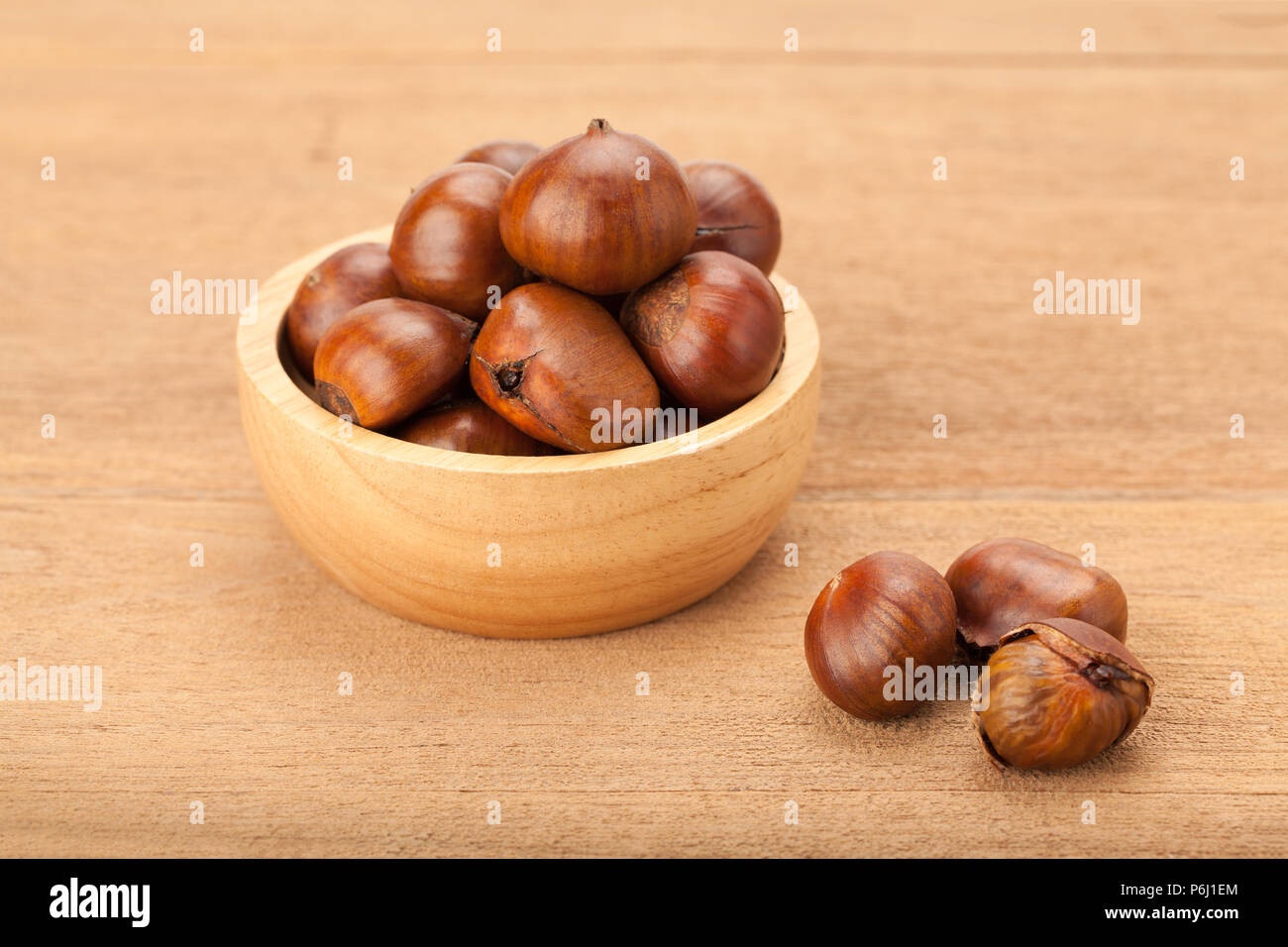 Chestnut in wooden bowl hi-res stock photography and images - Alamy
