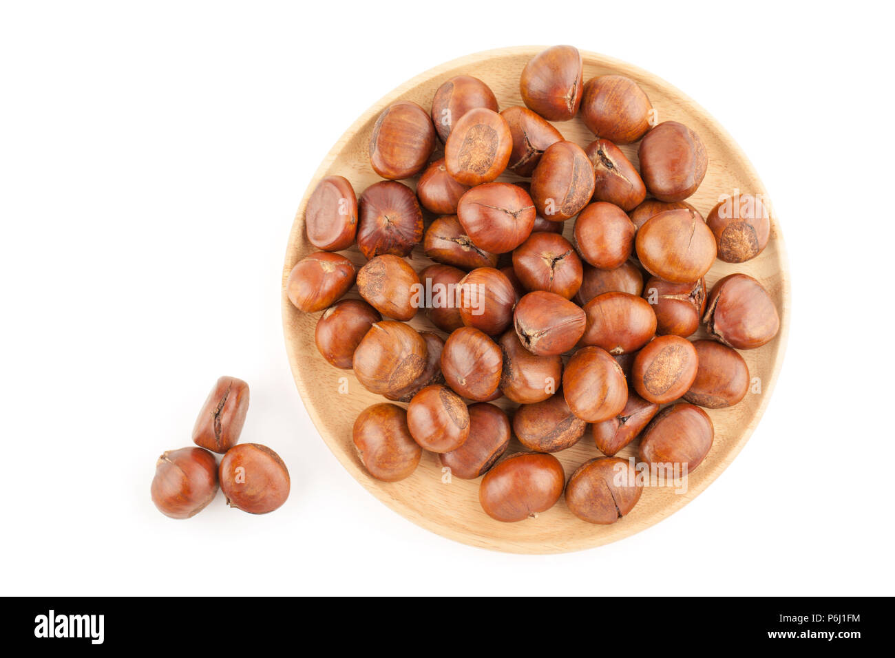 Top view angle of chestnut in wooden plate isolated on white background ...