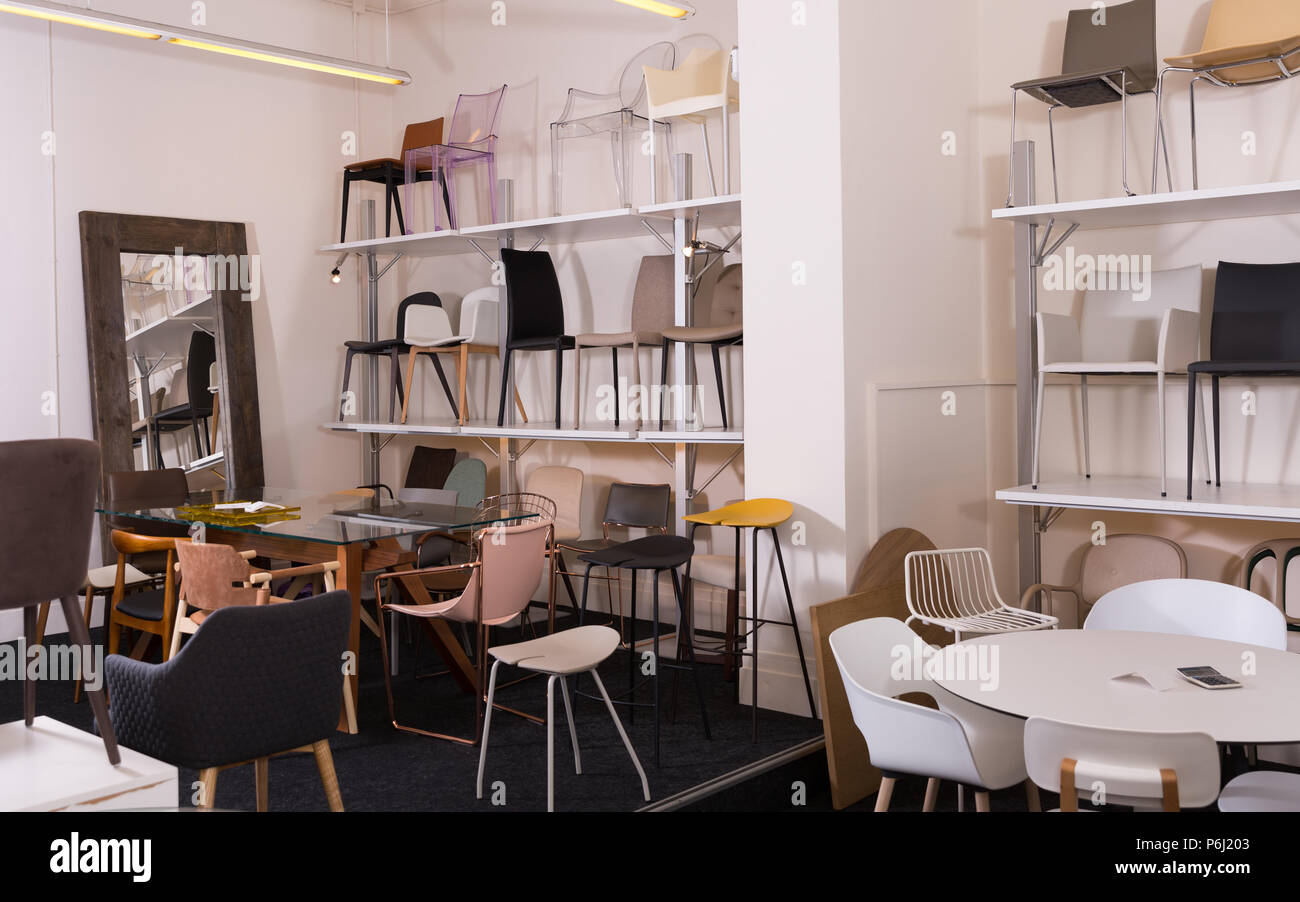 Wide selection of office and home chairs in modern furniture shop Stock ...