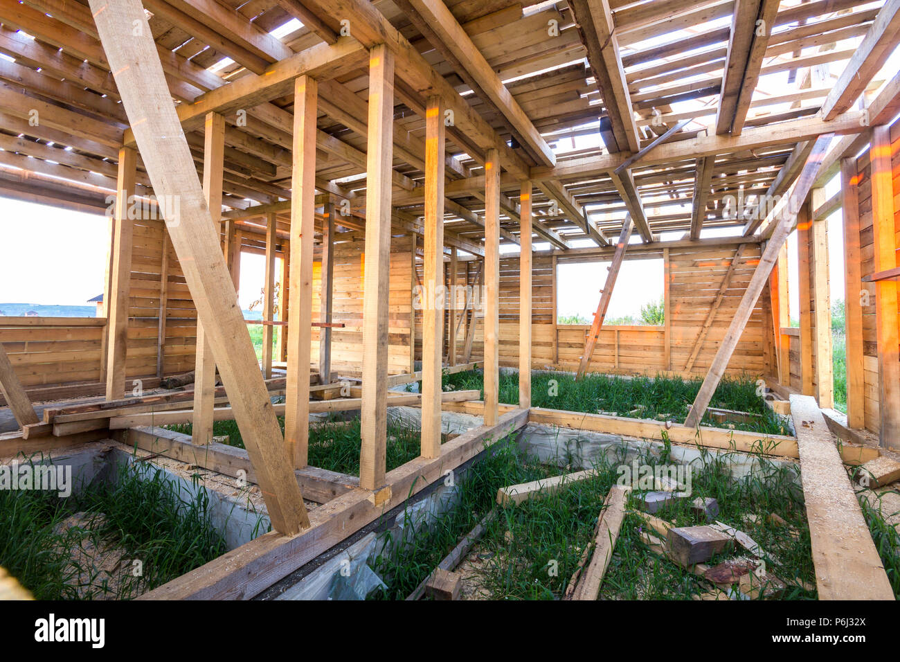 New wooden house under construction. Close-up of walls and ceiling ...