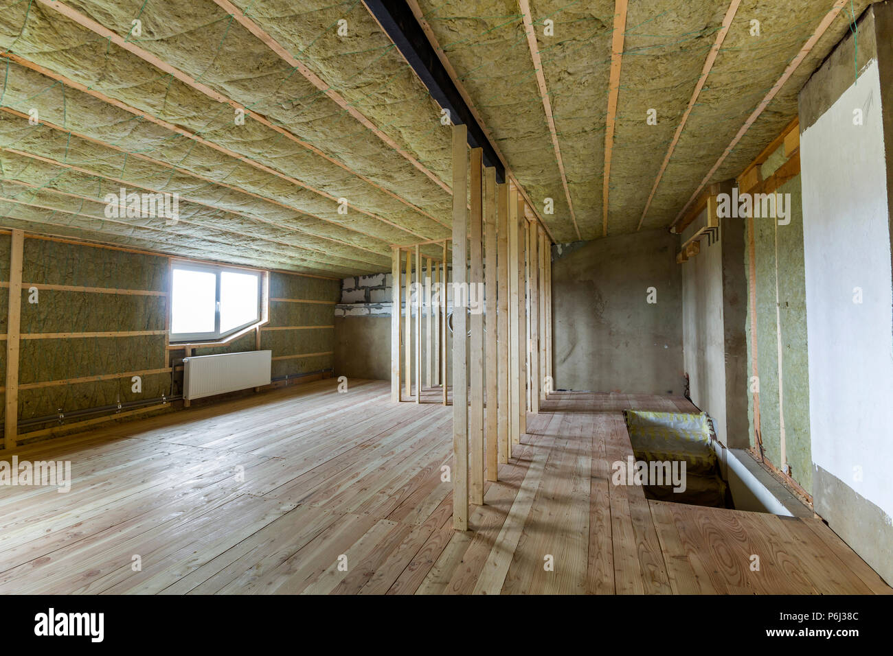 Construction and renovation of big light spacious empty room with oak ...