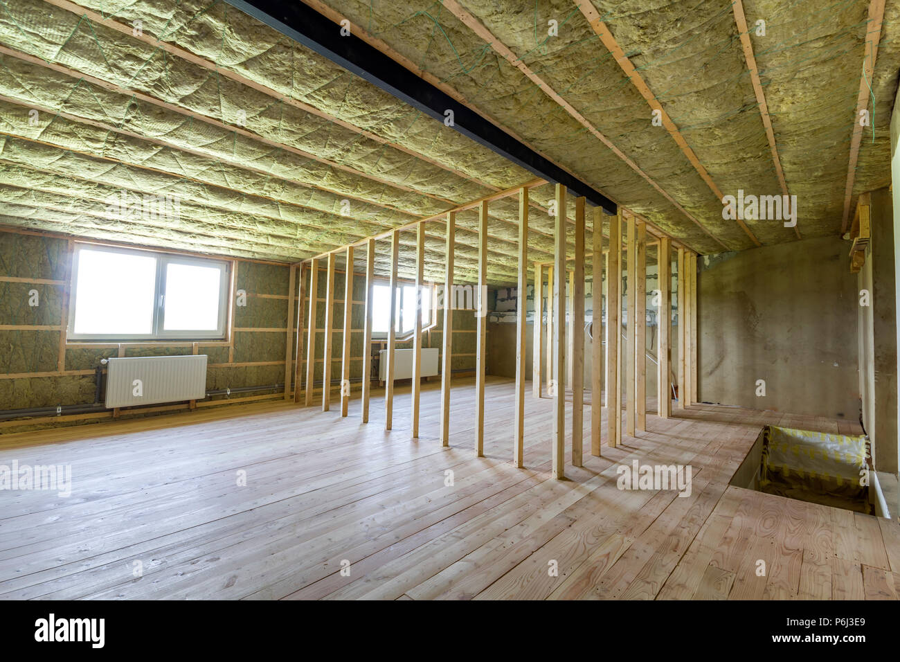 Construction and renovation of big light spacious empty room with oak ...
