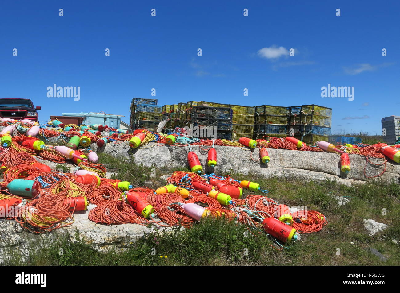 The multi-coloured buoys, nets, ropes and lobster traps make a ...