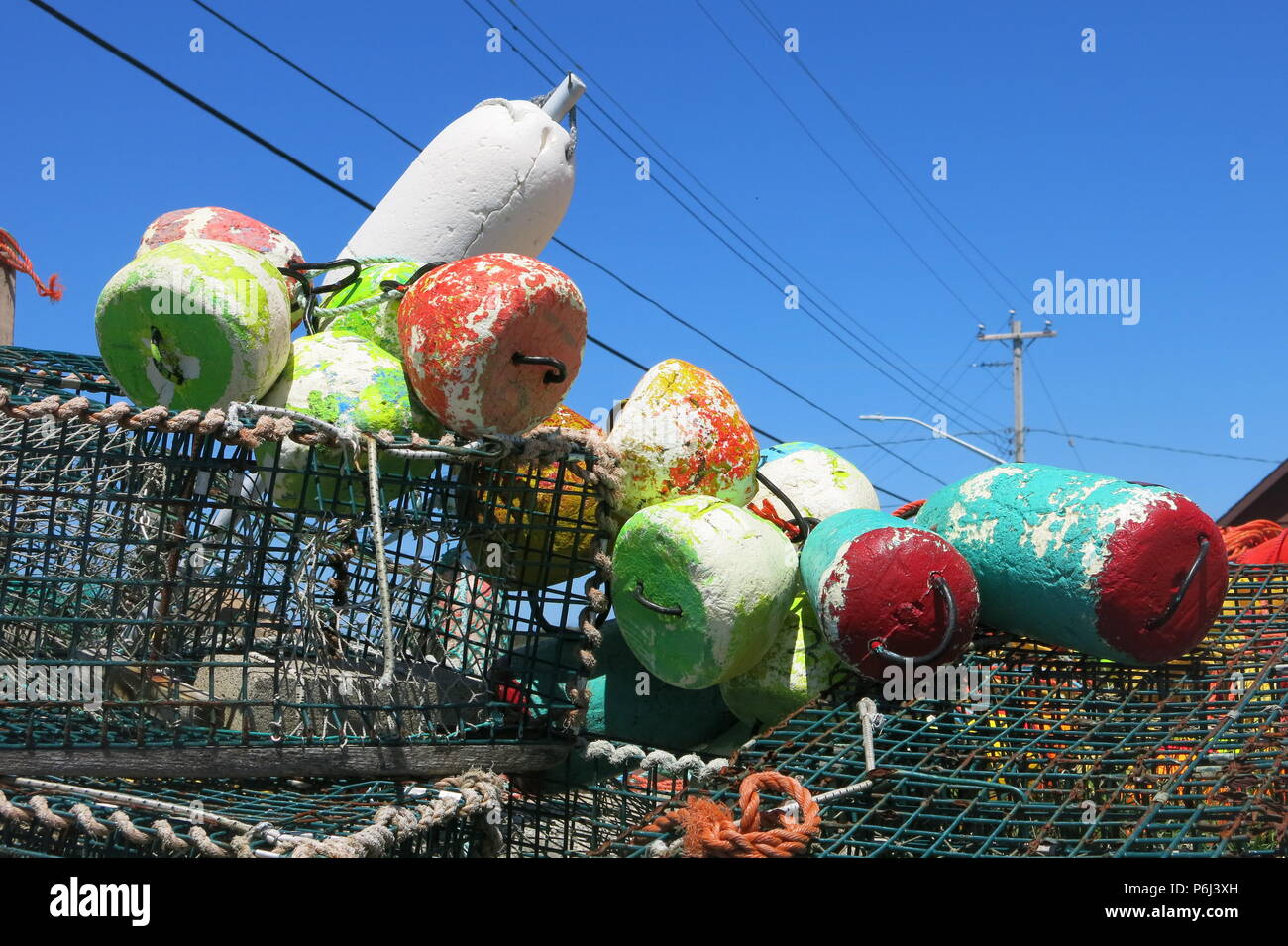 The multi-coloured buoys, nets, ropes and lobster traps make a ...