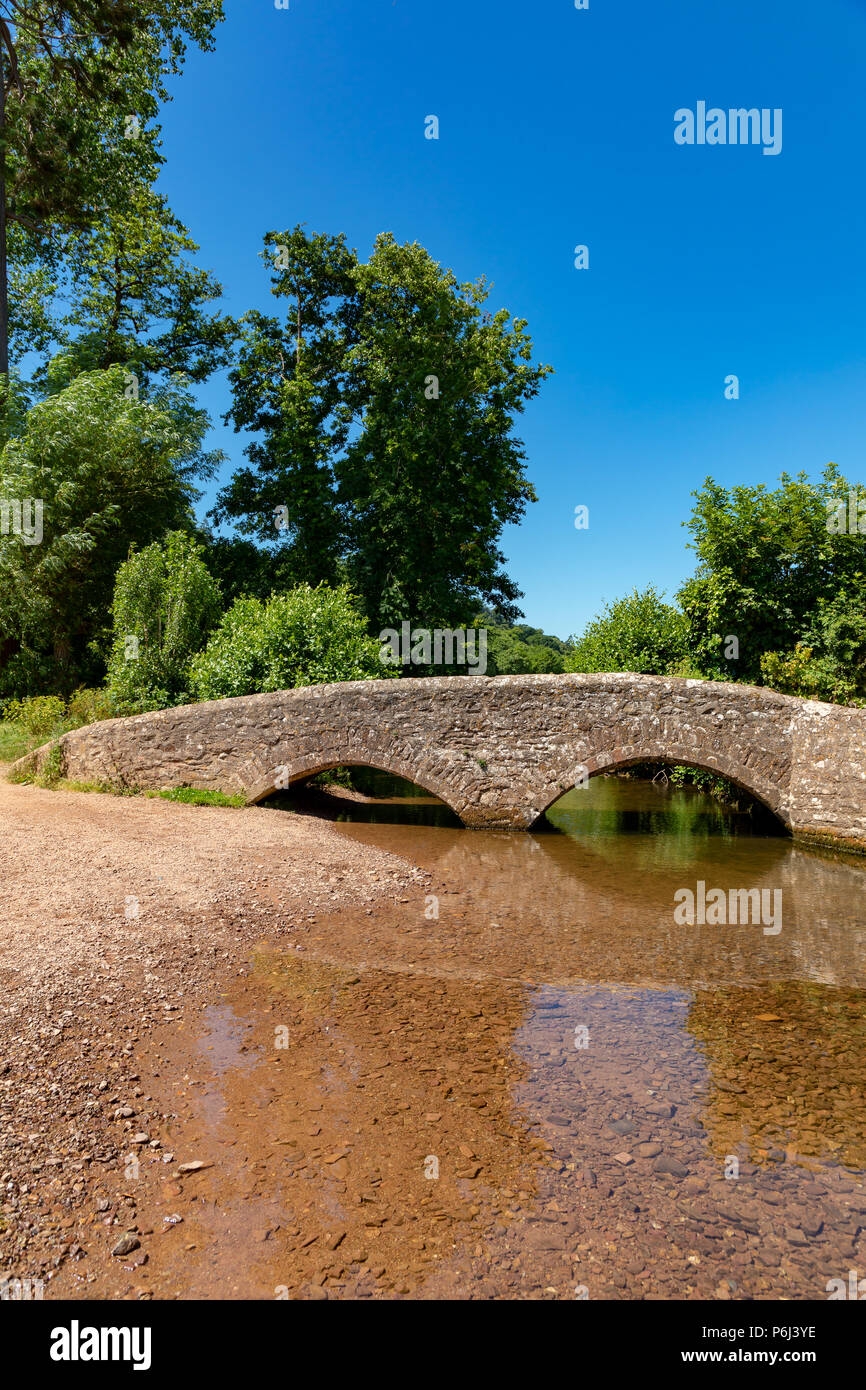 Dunster Somerset England June 27, 2018 The Gallox bridge across the ...
