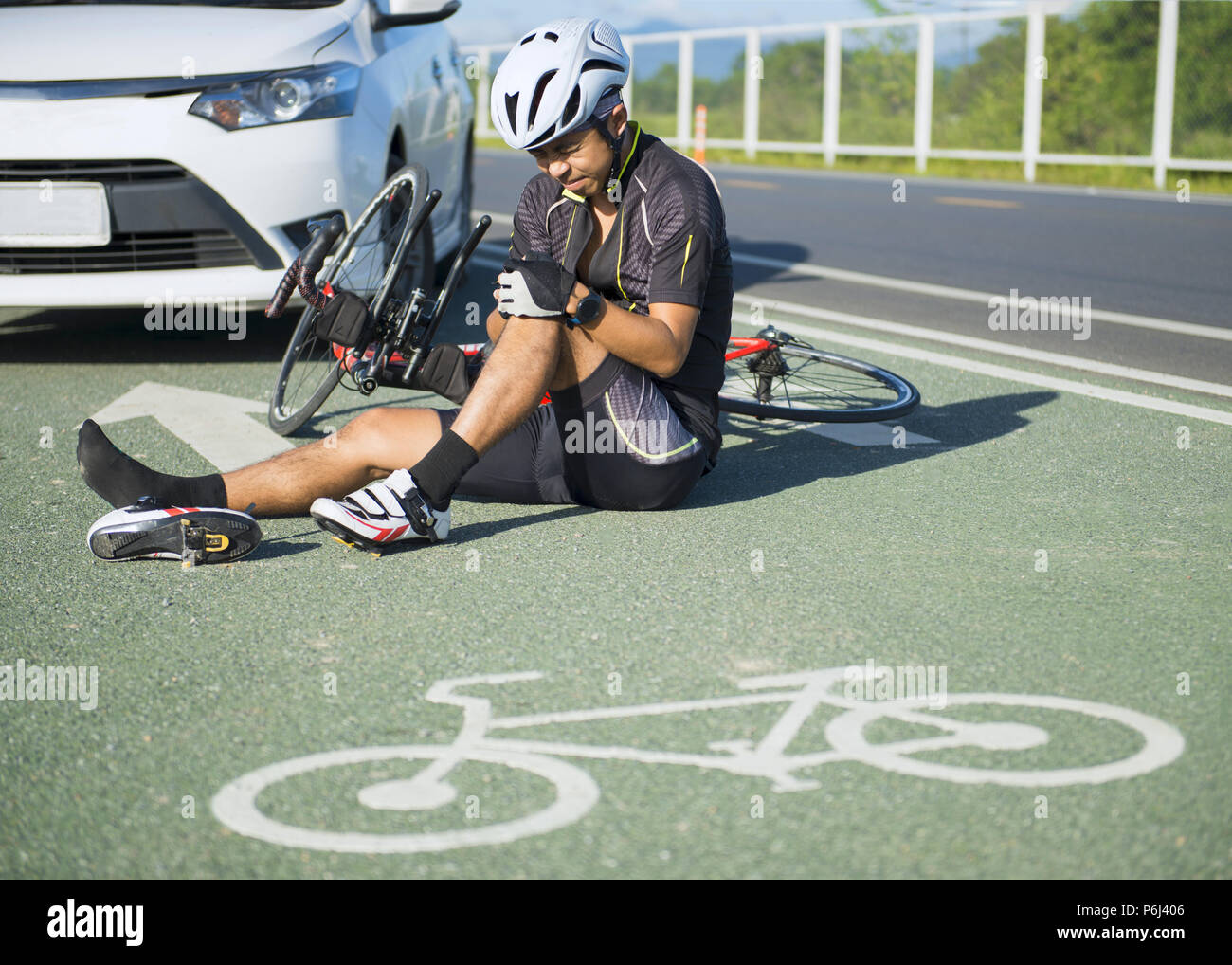 Asia cyclist injured on the street bike after collision accident car ...