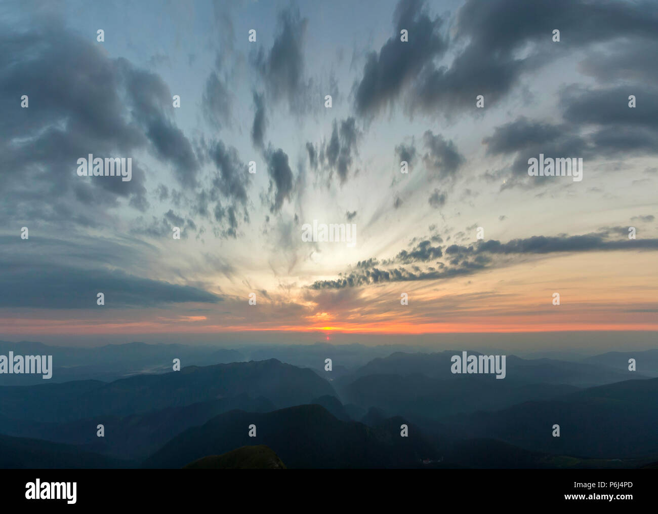 Fantastic sunrise or sunset over green mountain ridge covered with ...